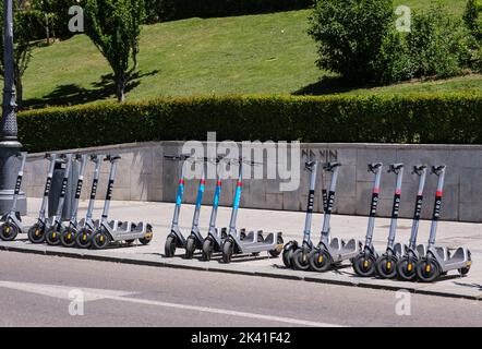 Spain, Madrid. Motorized Scooters for Rent, Opposite the Royal Palace ...
