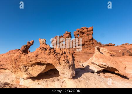 Eroded sandstone in front of an Organ Rock Shale formation in the Maze ...
