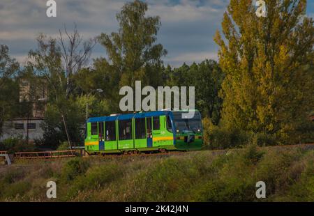Green train of private company in summer sunny evening near Rakovnik ...