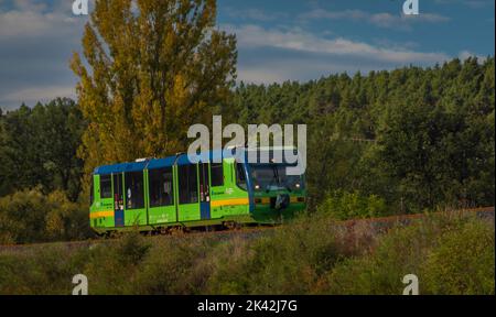 Green train of private company in summer sunny evening near Rakovnik ...