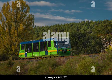 Green train of private company in summer sunny evening near Rakovnik ...