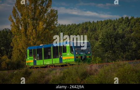 Green train of private company in summer sunny evening near Rakovnik ...