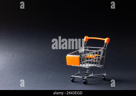 Composition of shopping cart and copy space on gray background Stock ...