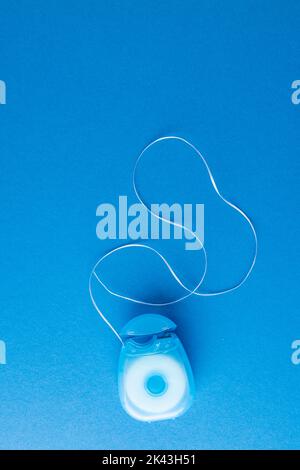 Image of dental string on blue surface Stock Photo - Alamy