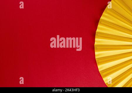 Composition of traditional chinese fan on red background Stock Photo ...
