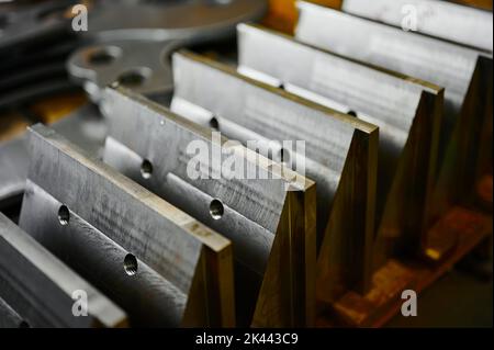 Processed metal plates with ground edges in warehouse Stock Photo - Alamy