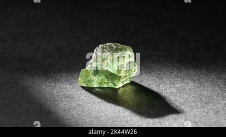Translucent Green Apatite Crystal Healing Stone on Wooden Background ...