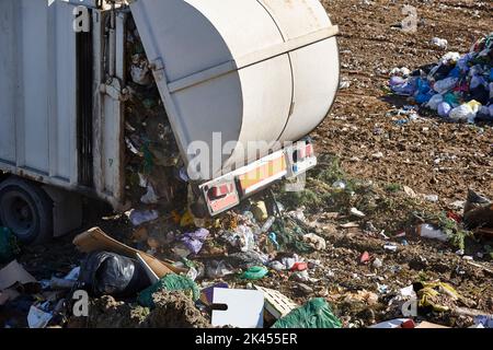Truck unloading garbage on an open air dump. Waste recycling Stock ...
