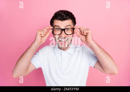 Photo of young impressed crazy man can't stop laughing watching funny ...