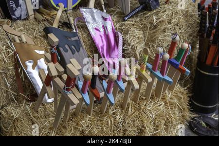 Detail of children's wooden toys, medieval swords Stock Photo - Alamy