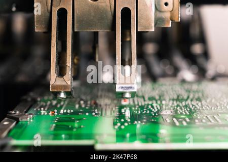 SMD surface-mount device working on printed circuit board PCB mounting ...