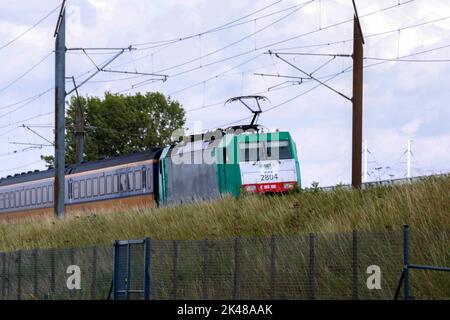 Traxx locomotive on intercity direct train at railroad track Stock ...