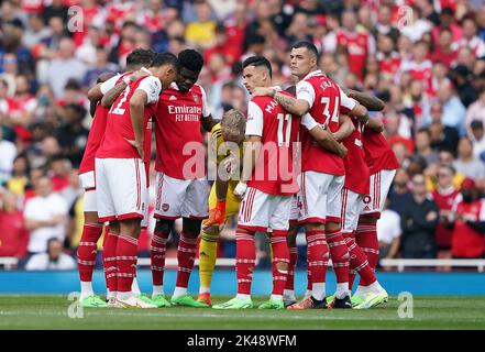 Arsenal players have a team huddle during the Premier League match at ...