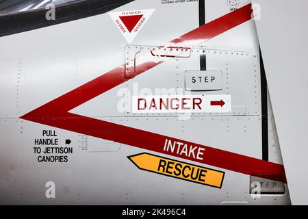 Caution warning sign on fuselage and wings of modern jet fighter ...