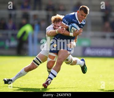 Sale Sharks' Joe Carpenter is tackled by Saracens' Lucio Cinti during ...
