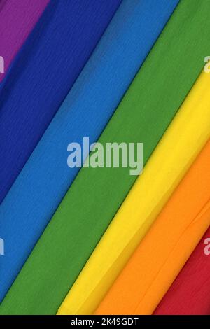 purple roll of wrapping paper in female hands on a beige background ...