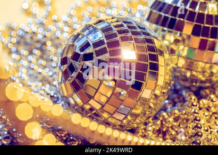 disco ball concept. Isolated on yellow background Stock Photo - Alamy