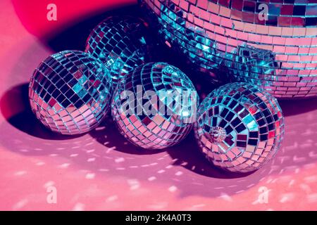 Mirror disco balls over pink background. Party, nightlife concept Stock ...