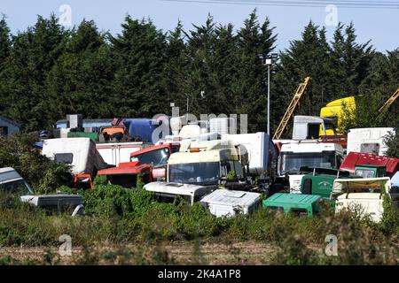heavy goods vehicles in a scrapyard Stock Photo - Alamy
