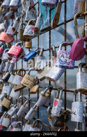 A vertical shot of love locks on Hohenzollern bridge in Cologne ...