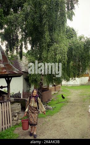 Arges County, Romania, 2002. An elderly woman wearing the traditional ...