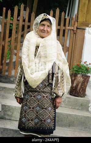 Nucsoara, Arges County, Romania, approx. 2000. Elderly woman wearing a ...