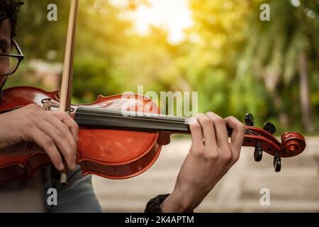 Close-up of hands playing the violin Stock Photo - Alamy