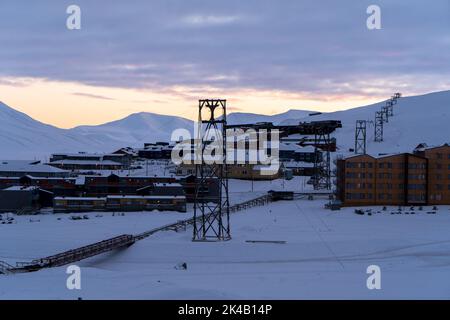 Decommissioned cable car timber structure towers in winter landscape ...
