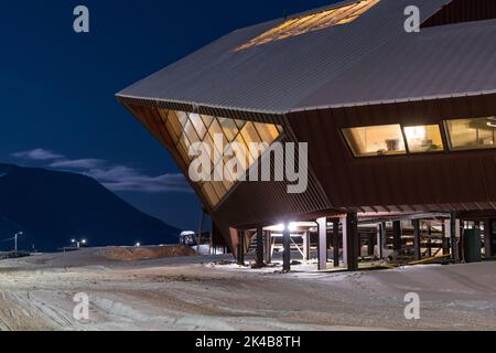 Svalbard University Science Centre at night on raised stilts permafrost ...