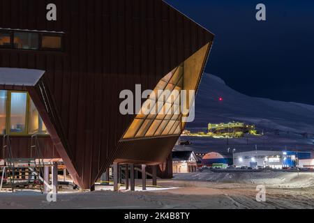 Svalbard University Science Centre at night on raised stilts permafrost ...