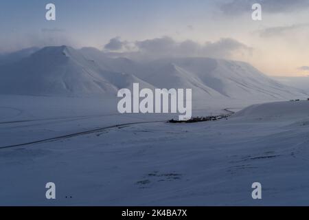 Raised pipelines through snowy Svalbard landscape, Longyearbyen Stock ...
