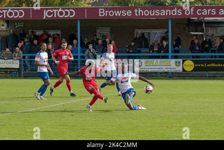 Kelly Nmai of Salford City FC is tackled by Reece Hutchinson of Crewe ...