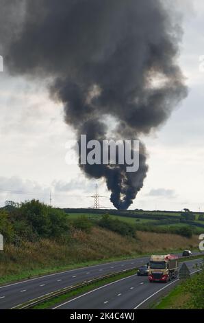 Tractor and hay baler had caught fire Stock Photo - Alamy