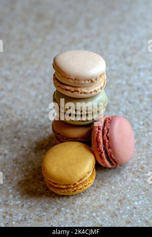 Still life of crispy meringue macarons filled with luscious creamy ...