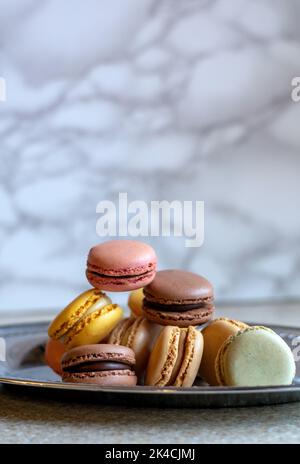 Still life of crispy meringue macarons filled with luscious creamy ...