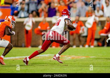 North Carolina State's Devin Carter (88) stiff arms Connecticut's Cale ...