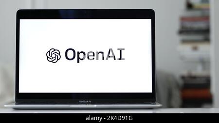 OpenAI logo seen on the screen of smartphone. AI software developer ...