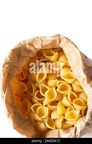 Conchiglie pasta shells in a brown paper bag. Eco-friendly recycling ...