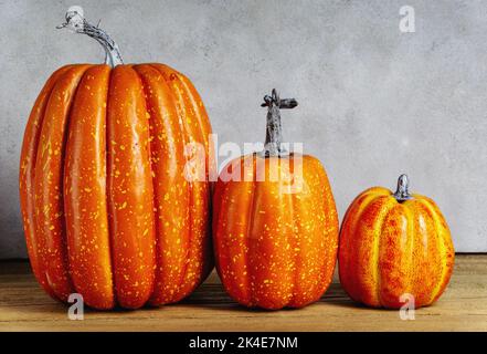 Three mock-up pumpkins on wooden table. Moody Style. Halloween concept ...