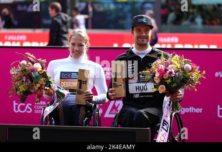 Switzerland's Catherine Debrunner (left) and Marcel Hug celebrate ...