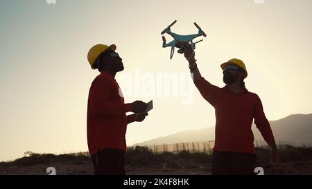 Drone engineers working on construction site - Aerial engineering ...