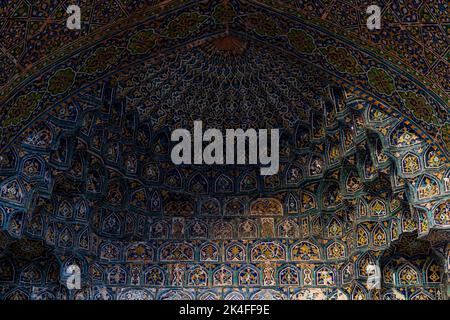 Registan intricate blue tile arch vault in courtyard at sunset ...