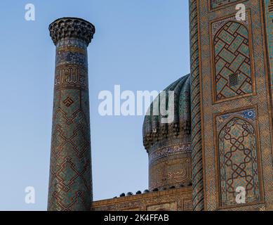 Sherdor Madrassa in Registan Complex at sunset with beautiful blue ...