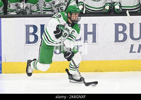 North Dakota Fighting Hawks forward Brady Danielson (15) dives under St ...
