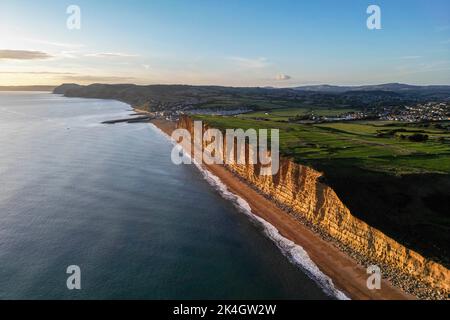 West Bay, Dorset, UK. 2nd July 2018. UK Weather. Sunbathers on the beach at the seaside resort ...