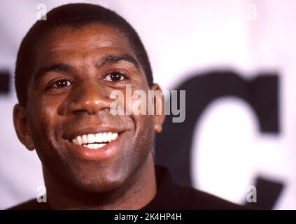 NBA superstar Ervin "Magic" Johnson shoots a free throw during game ...