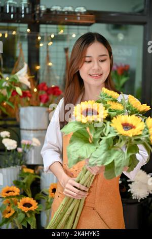 Portrait of smiling florist standing at entrance of shop Stock Photo ...