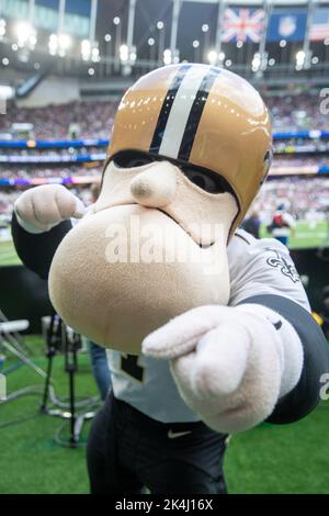 New Orleans Saints mascot "Sir Saint autographs the back of tattooed ...