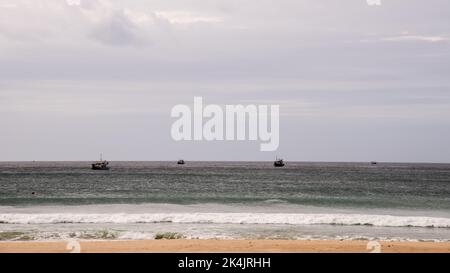 Beautiful picturesque multi-colored ocean with breakers, blue skies ...