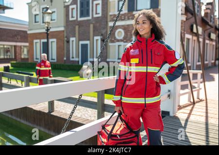 Female American Red Cross Worker stitching eye bandages on Sewing ...